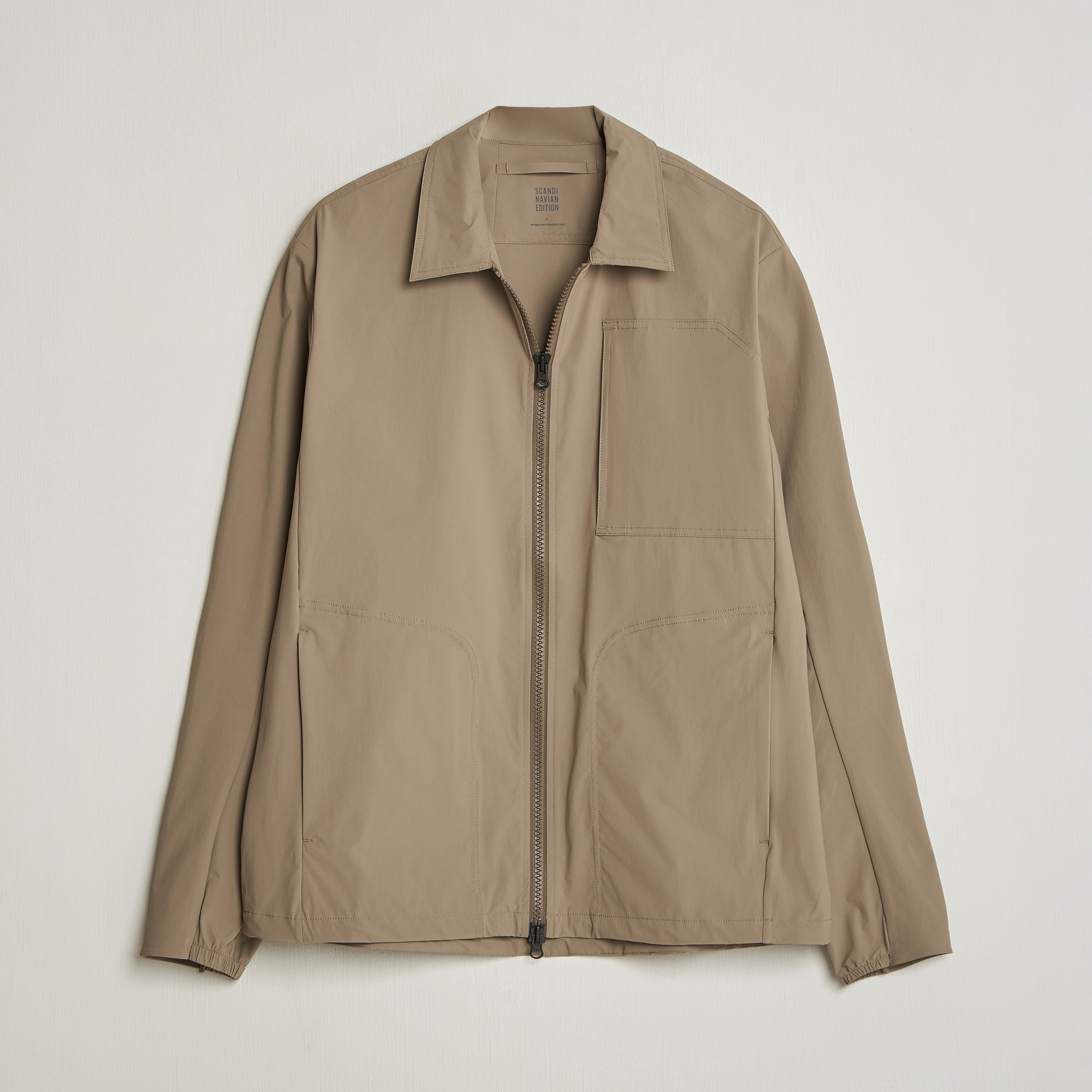 Scandinavian Edition Motion II Packable Jacket Sand bei Care of Carl
