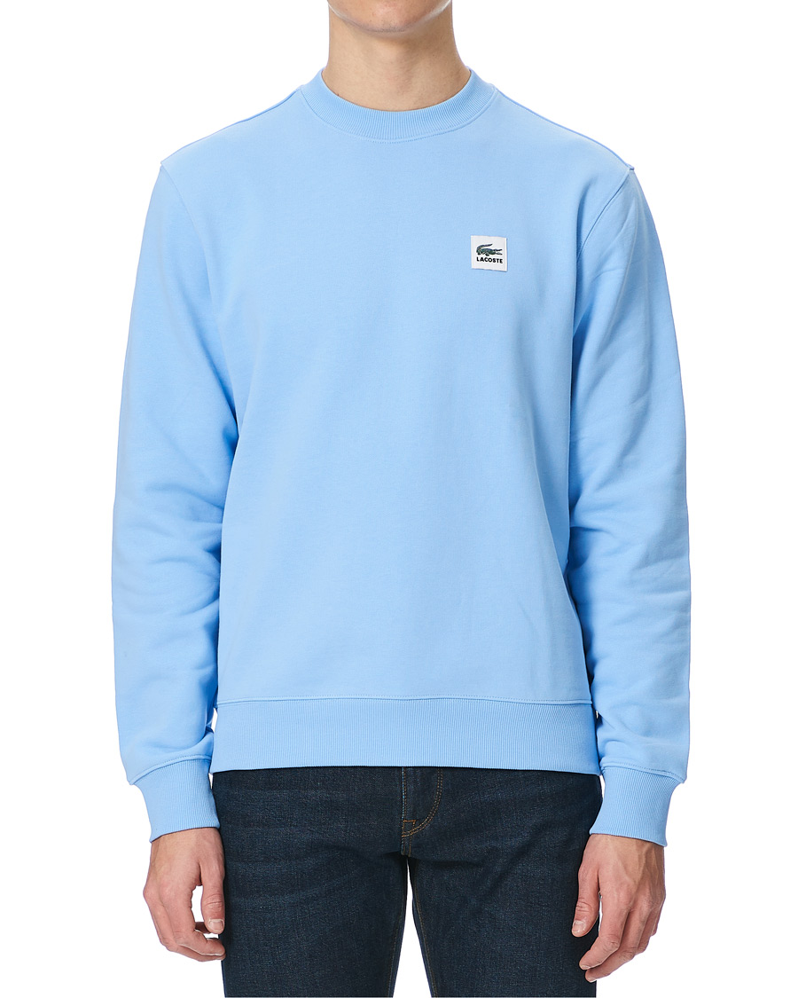 Lacoste Retro Crew Neck Sweatshirt Nattier Blue bei CareOfCarl.de